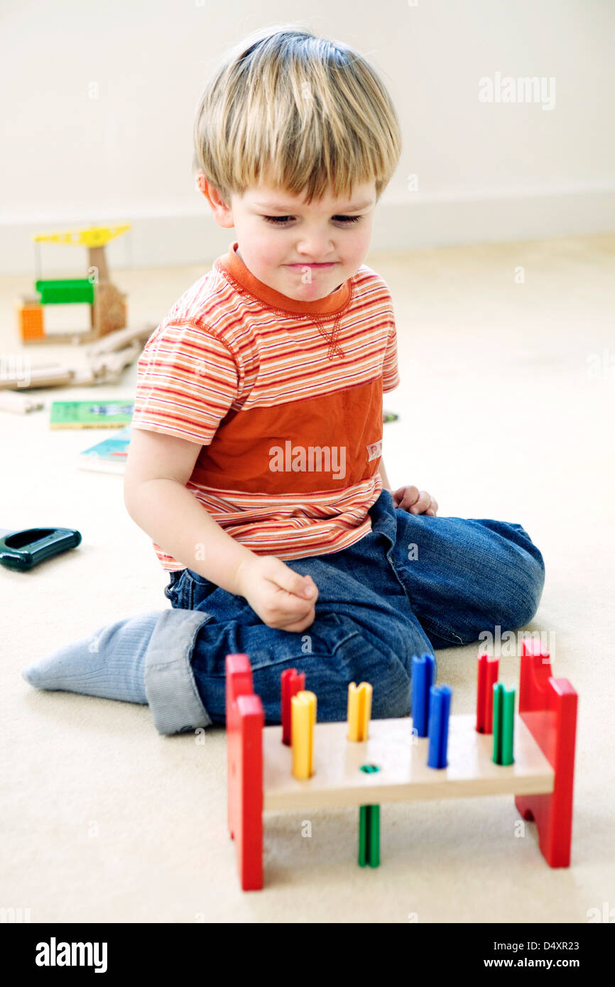 CHILD PLAYING INDOORS Stock Photo - Alamy