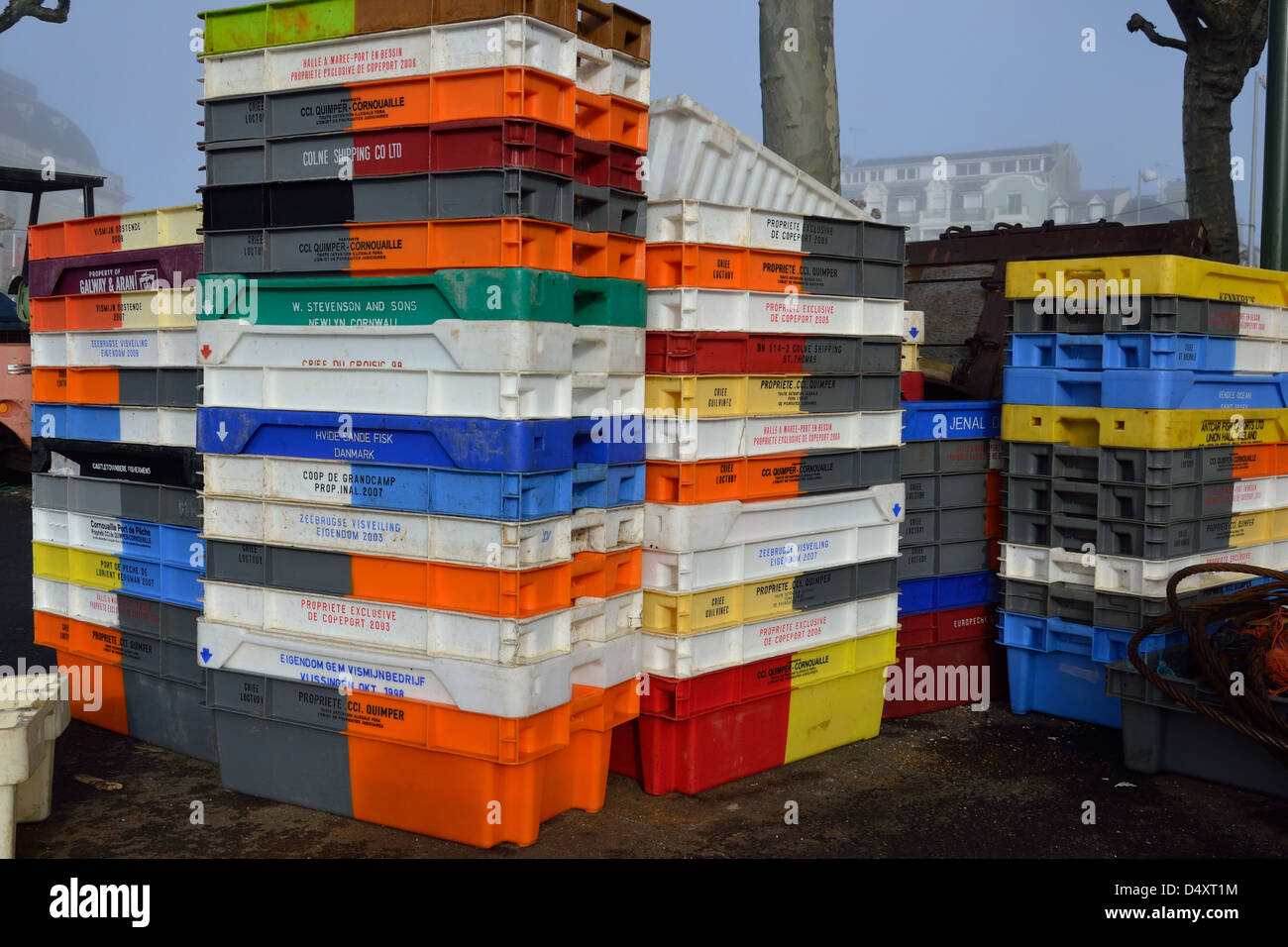 Fish crates of various colours stacked at the fish market Stock Photo ...