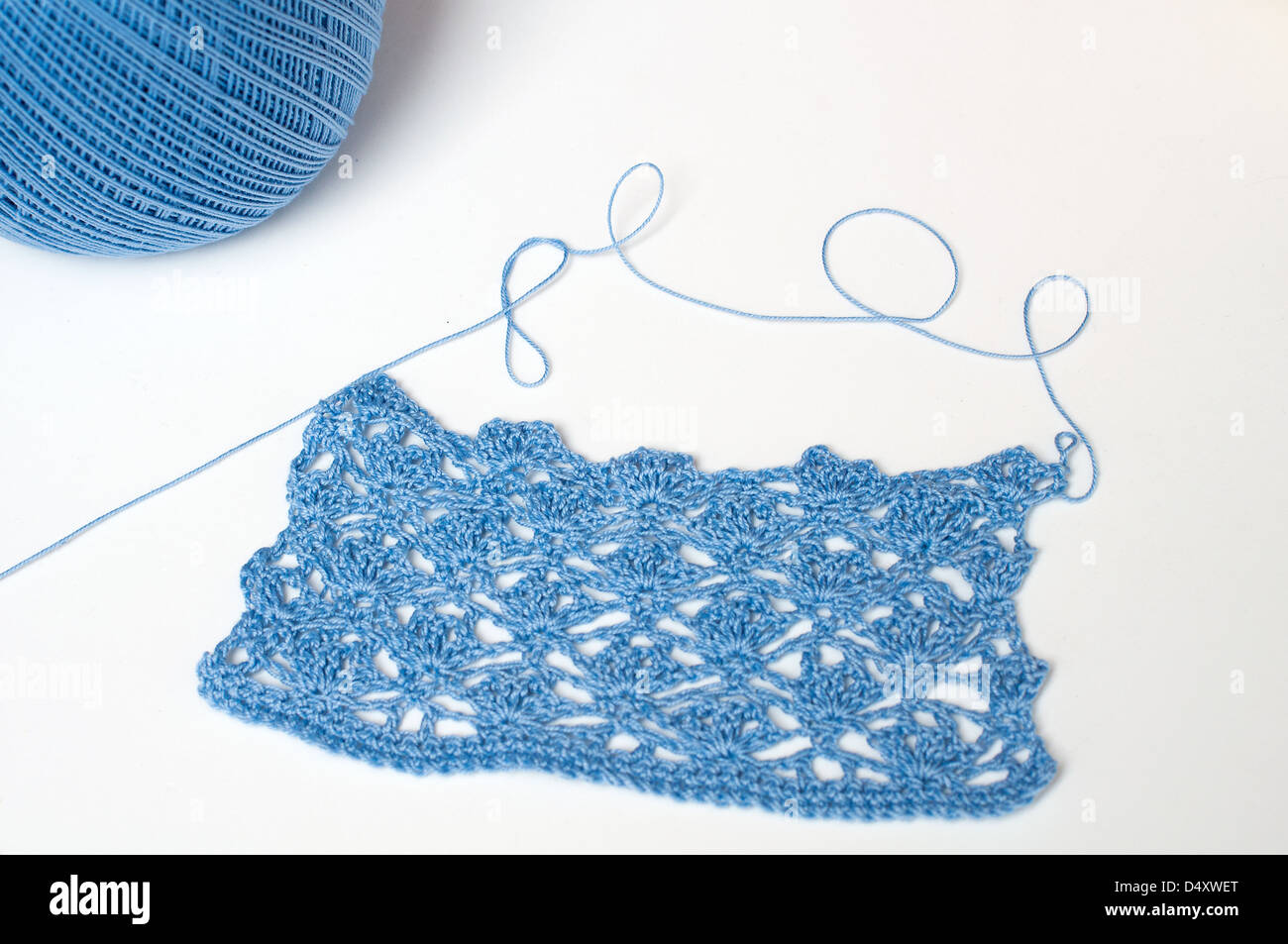 Crochet, blue yarn and crochet hook Stock Photo - Alamy