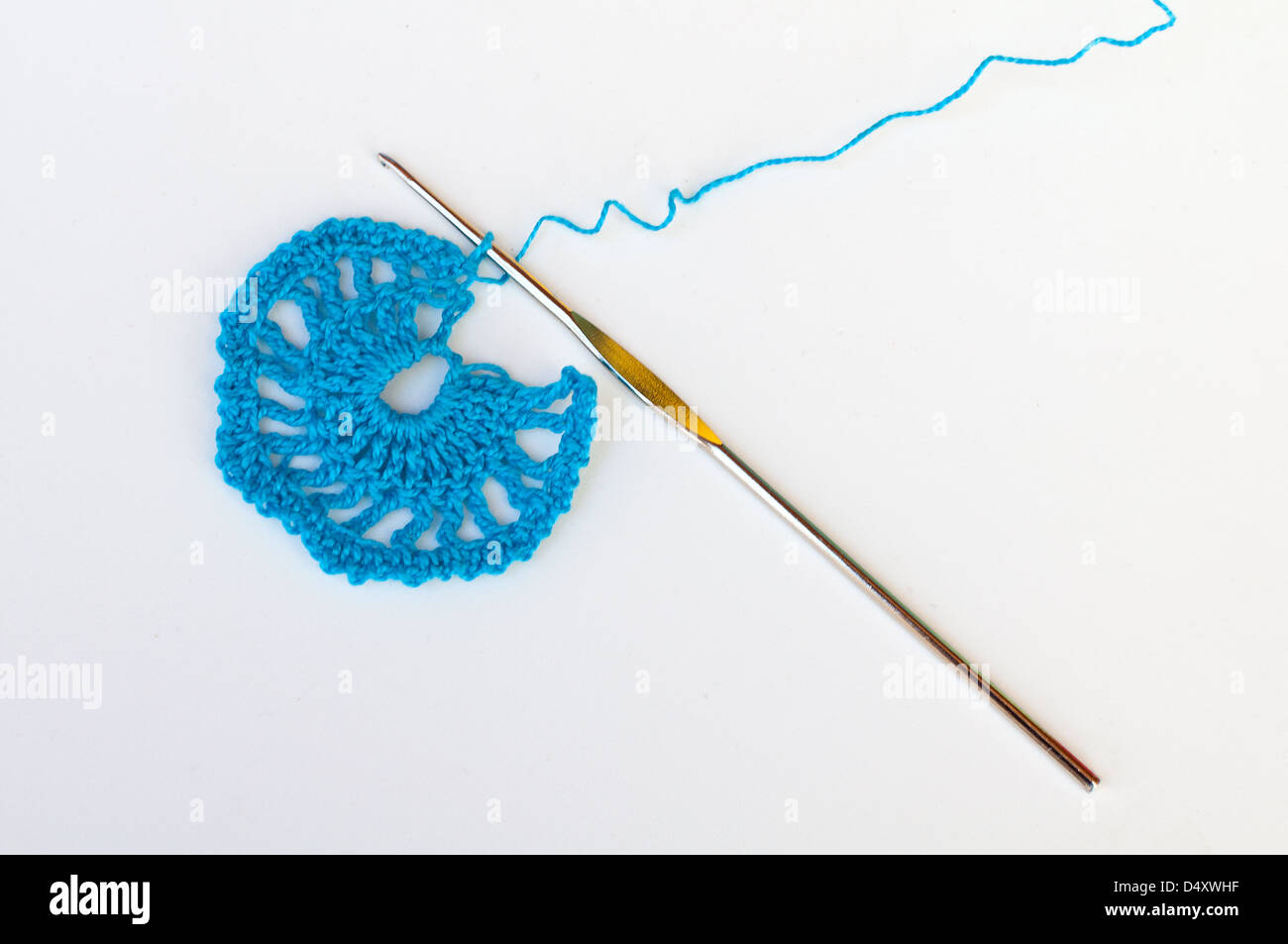 Blue crochet sample on white background Stock Photo - Alamy