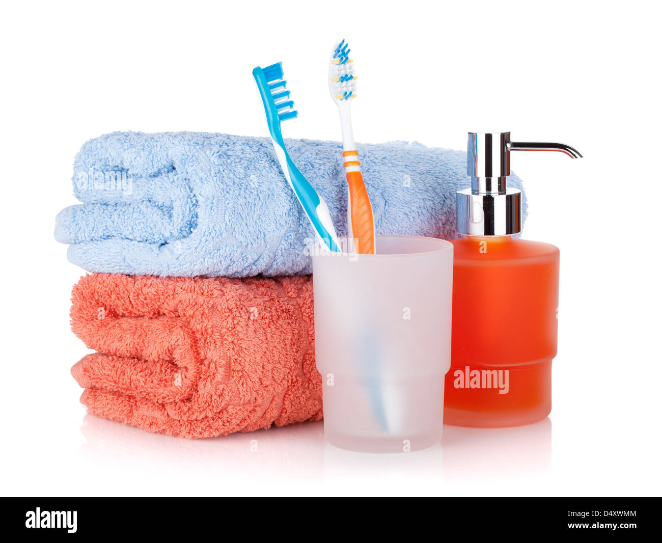 Toothbrushes, liquid soap and towels. Isolated on white background ...