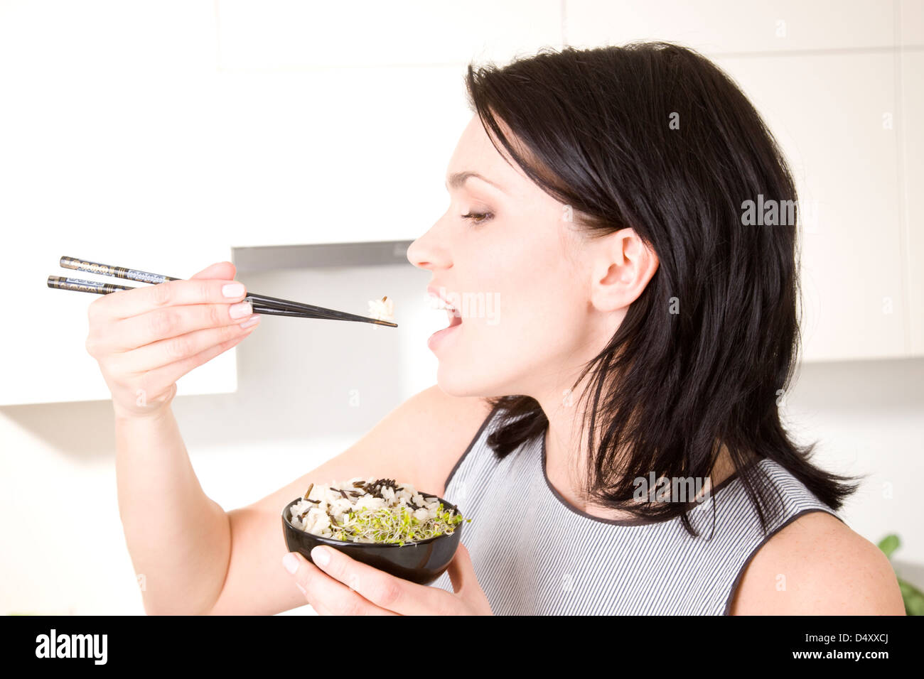 Woman eat rice hi-res stock photography and images - Alamy