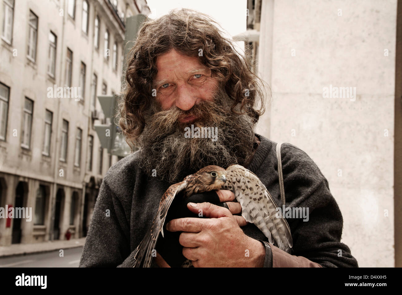 Portrait of homeless with his falcon pet Stock Photo - Alamy