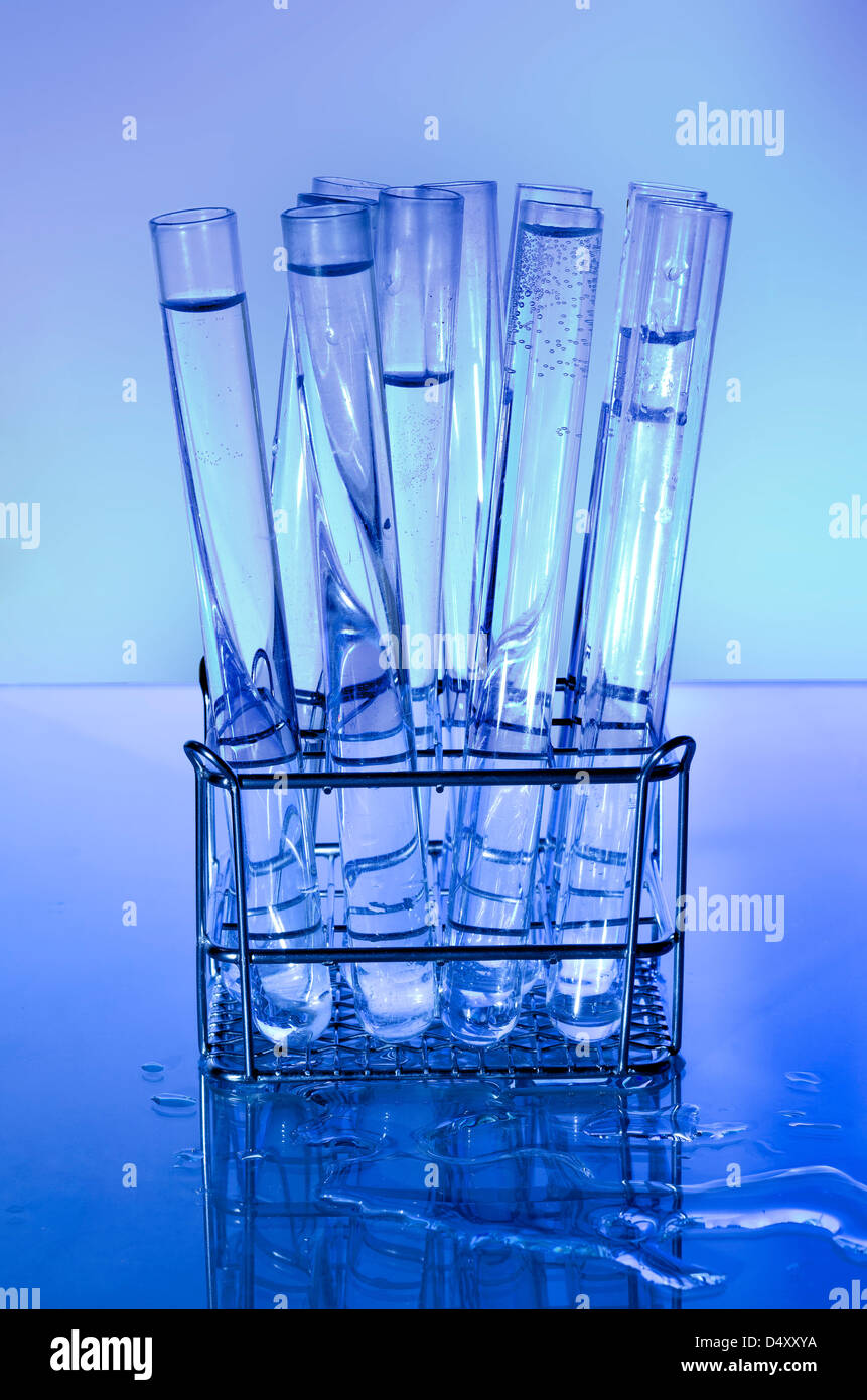rack of test tubes on blue background Stock Photo - Alamy