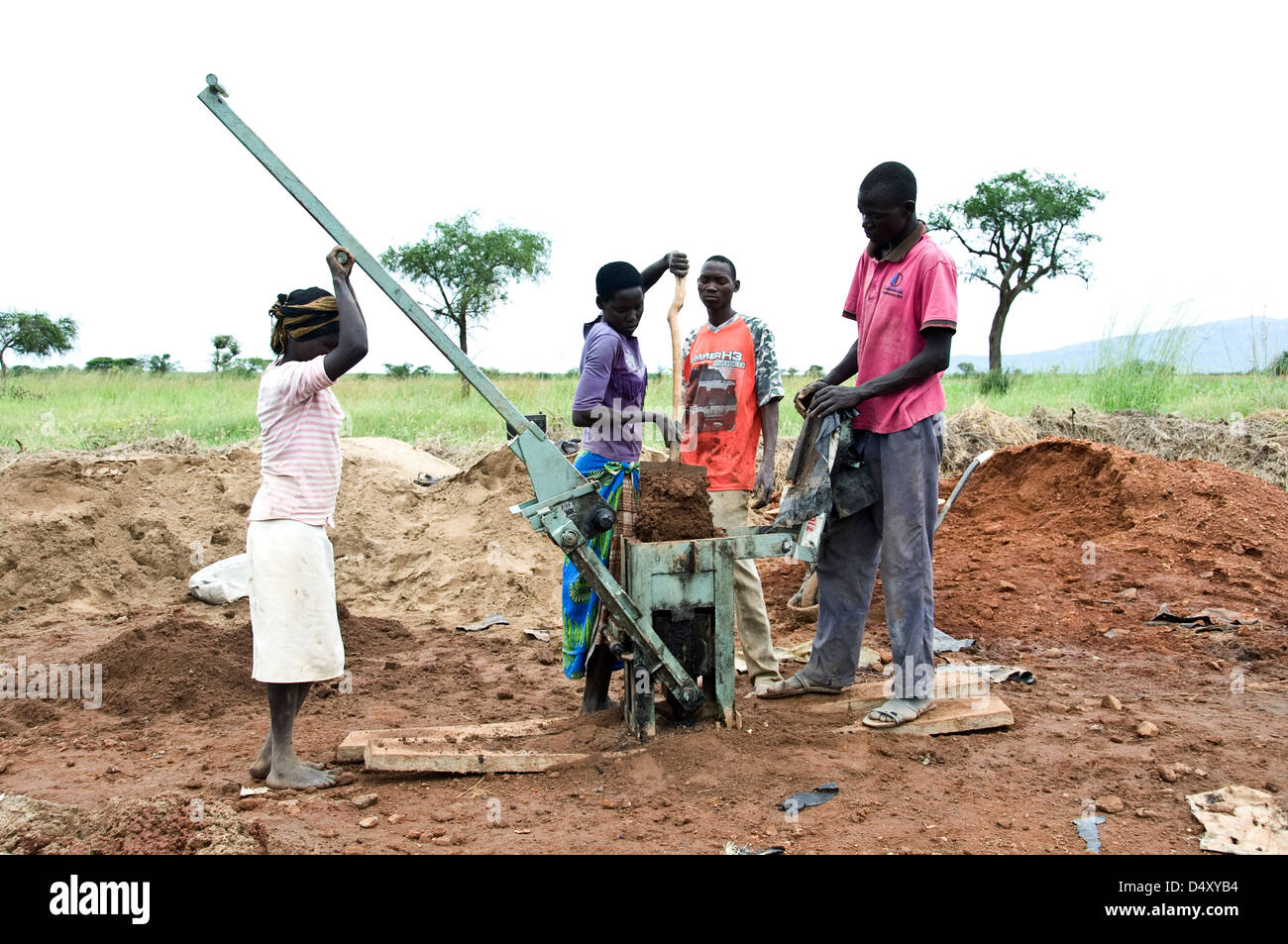 Karamoja youth making bricks in Napak District, Uganda Stock Photo - Alamy