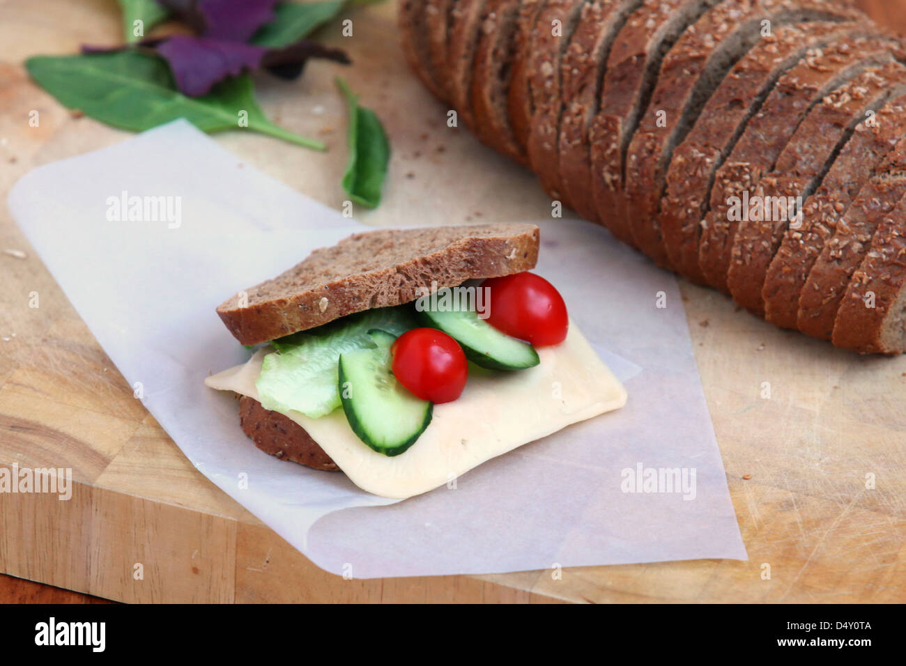 Yellow cheese sandwich with tomato and cucumber Stock Photo - Alamy