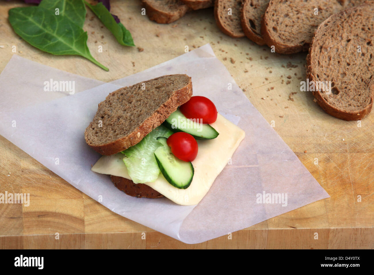 Yellow cheese sandwich with tomato and cucumber Stock Photo - Alamy