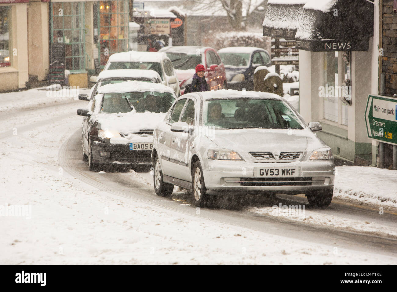 Cars driving through Ambleside in the snow, Lake District, UK Stock ...
