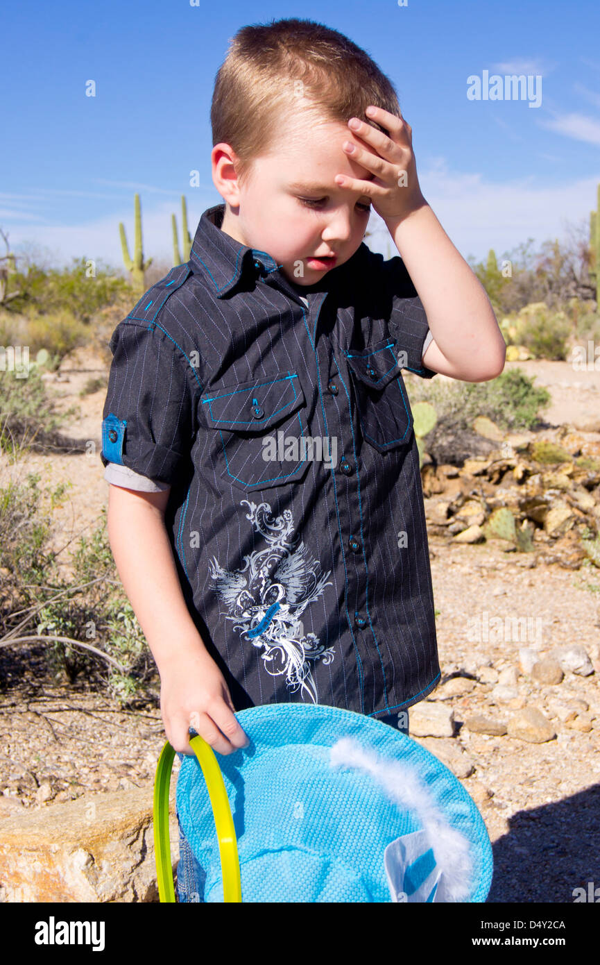 An autistic five year old boy shows that he is tired Stock Photo - Alamy