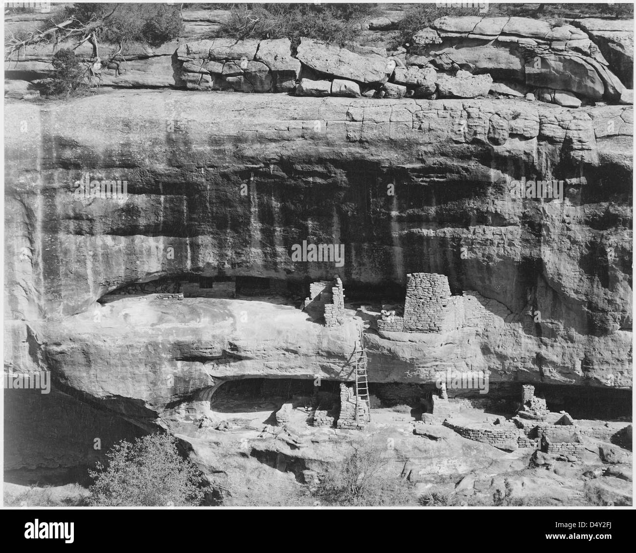 A black and white photograph by Ansel Adams of the cliff dwellings at ...