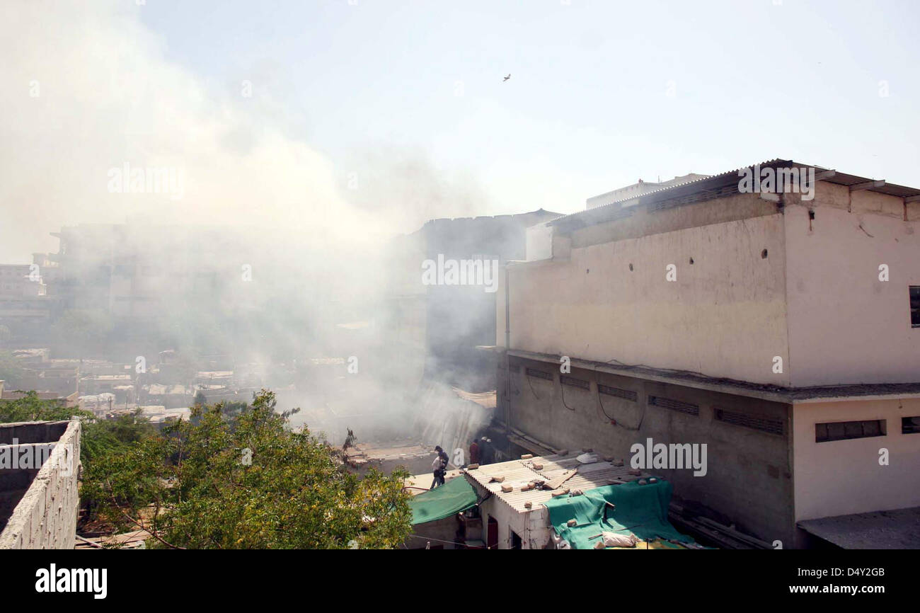 Smoke rises from a factory after fire eruption at a towel manufacturing ...