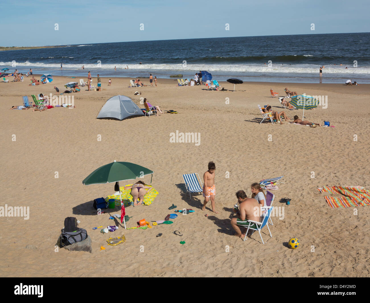 People and families enjoy beach at Punta Colorada, on the Atlantic ...