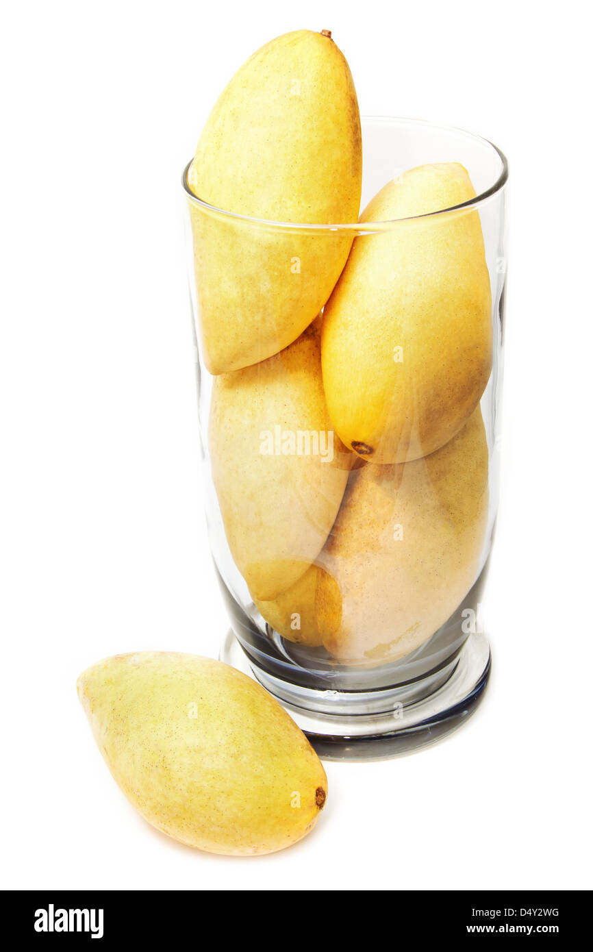Yellow mango in glass bowl on white background Stock Photo - Alamy