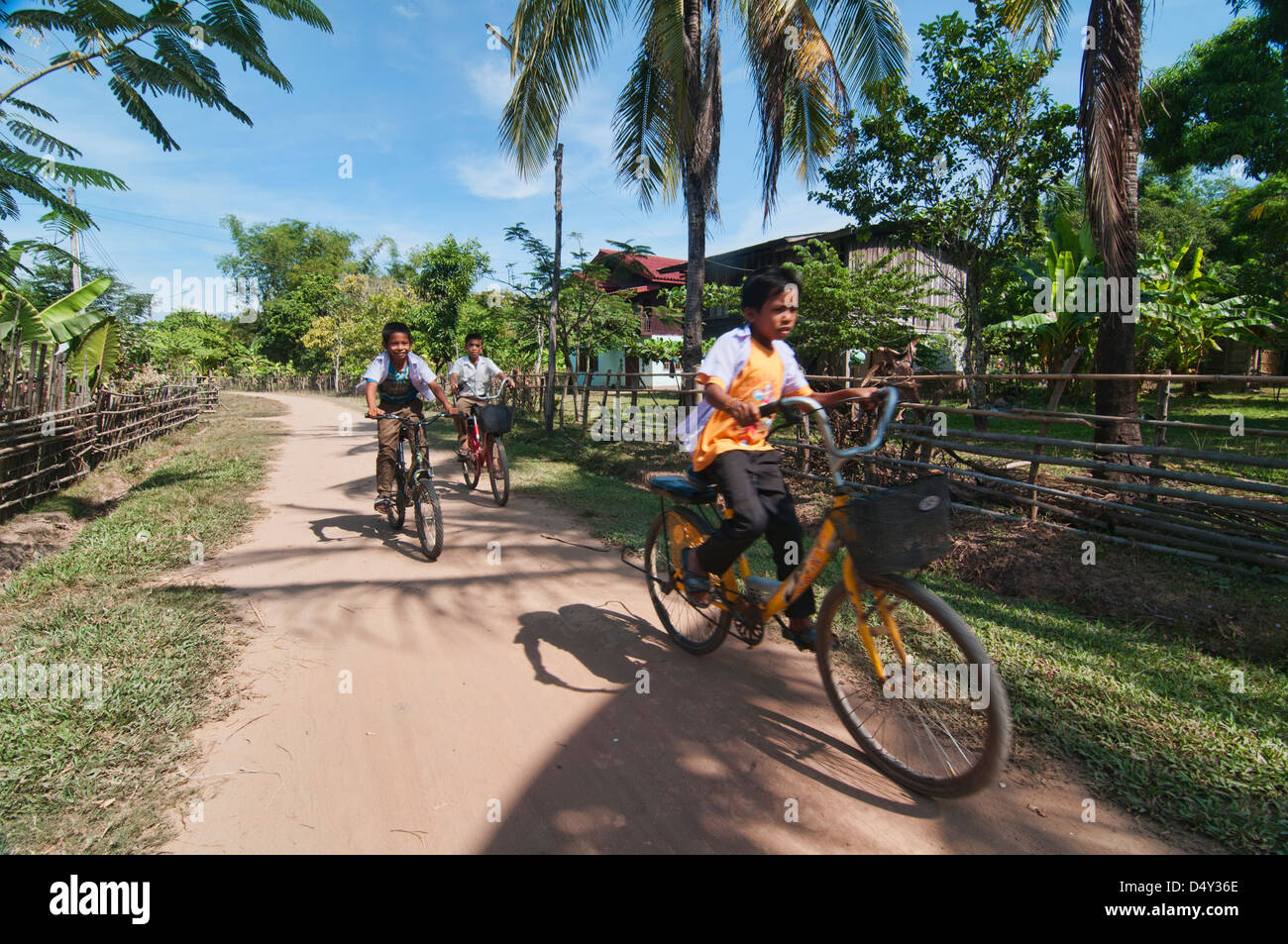 children riding bicycles in rural Laos, 4000 islands in the Mekong ...