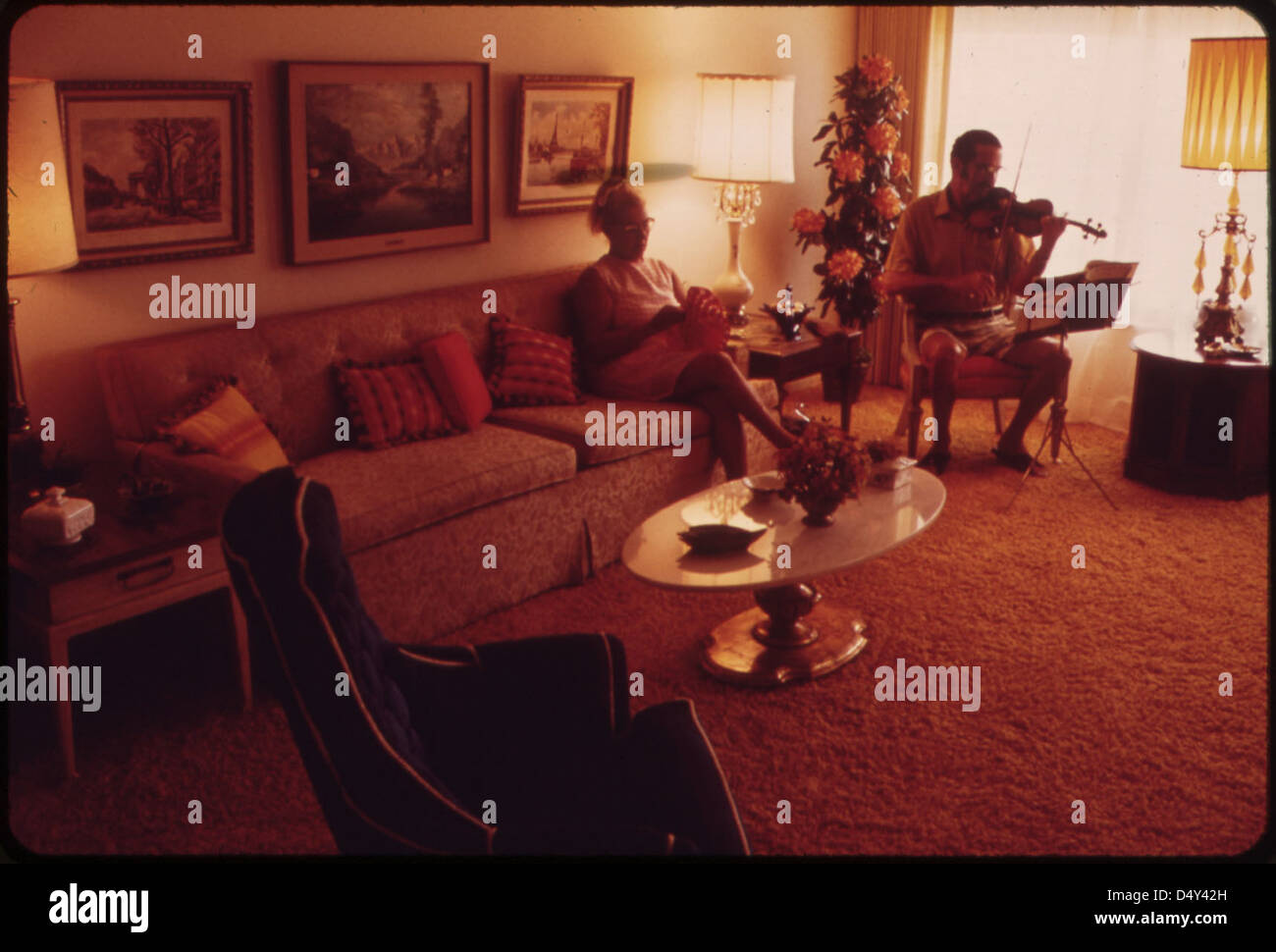 This photograph shows Ben and Hildred Ratner enjoying music in their ...