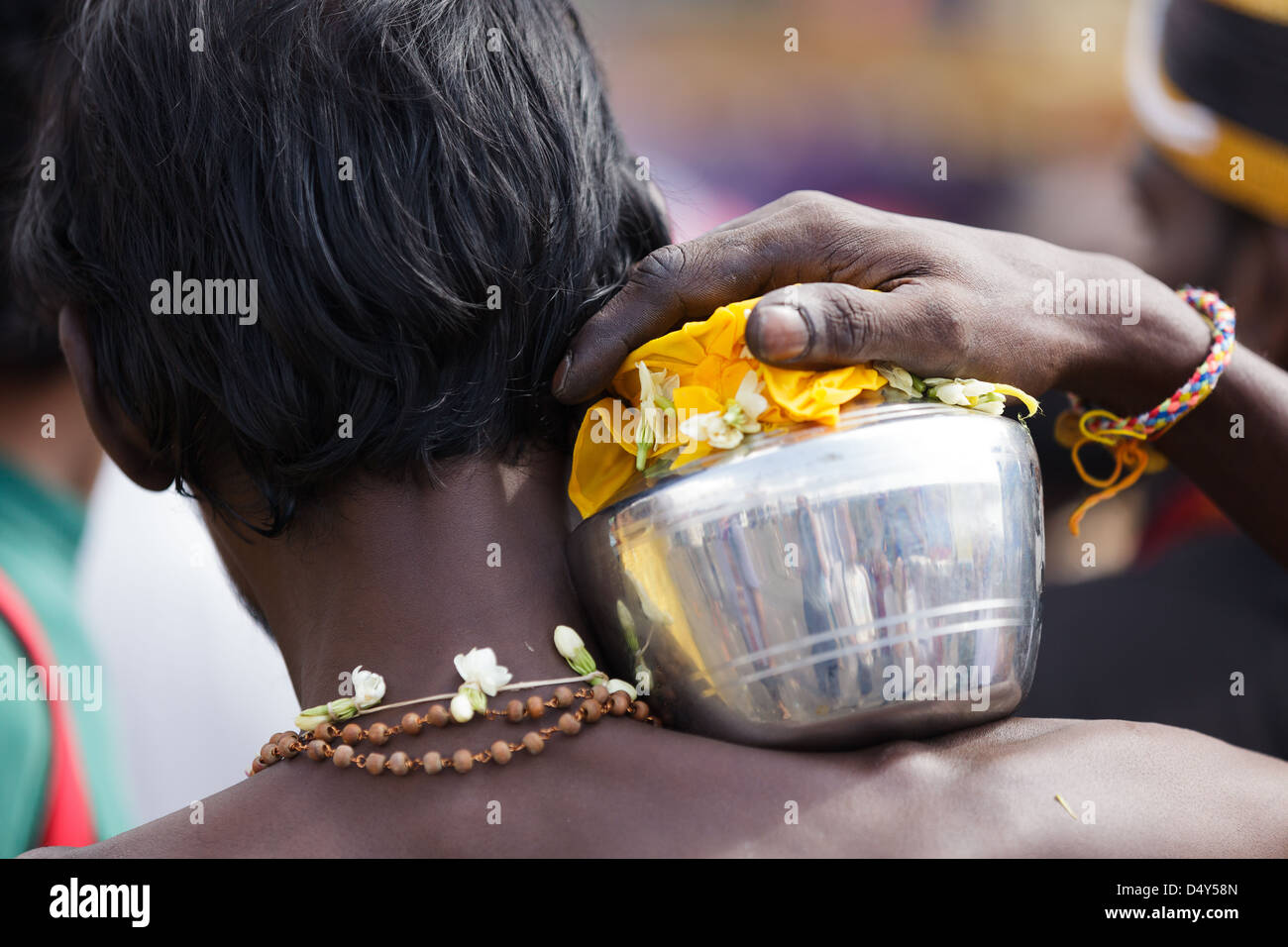 Hindu devotee holding milk pot in annual Thaipusam religious festival ...