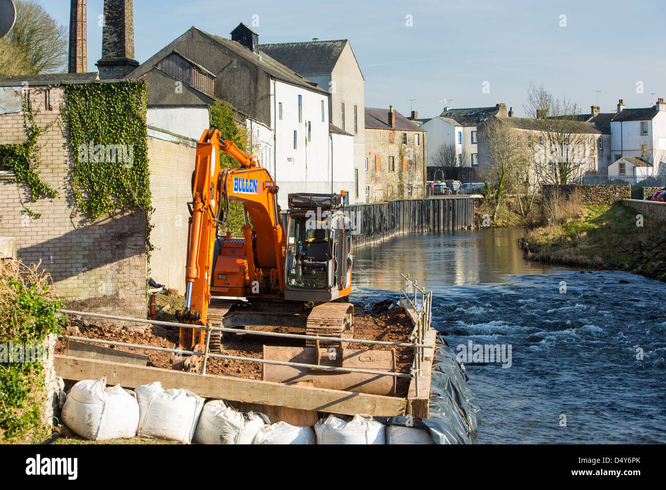 Building flood defences on the River cocker, in Cockermouth, Cumbria ...