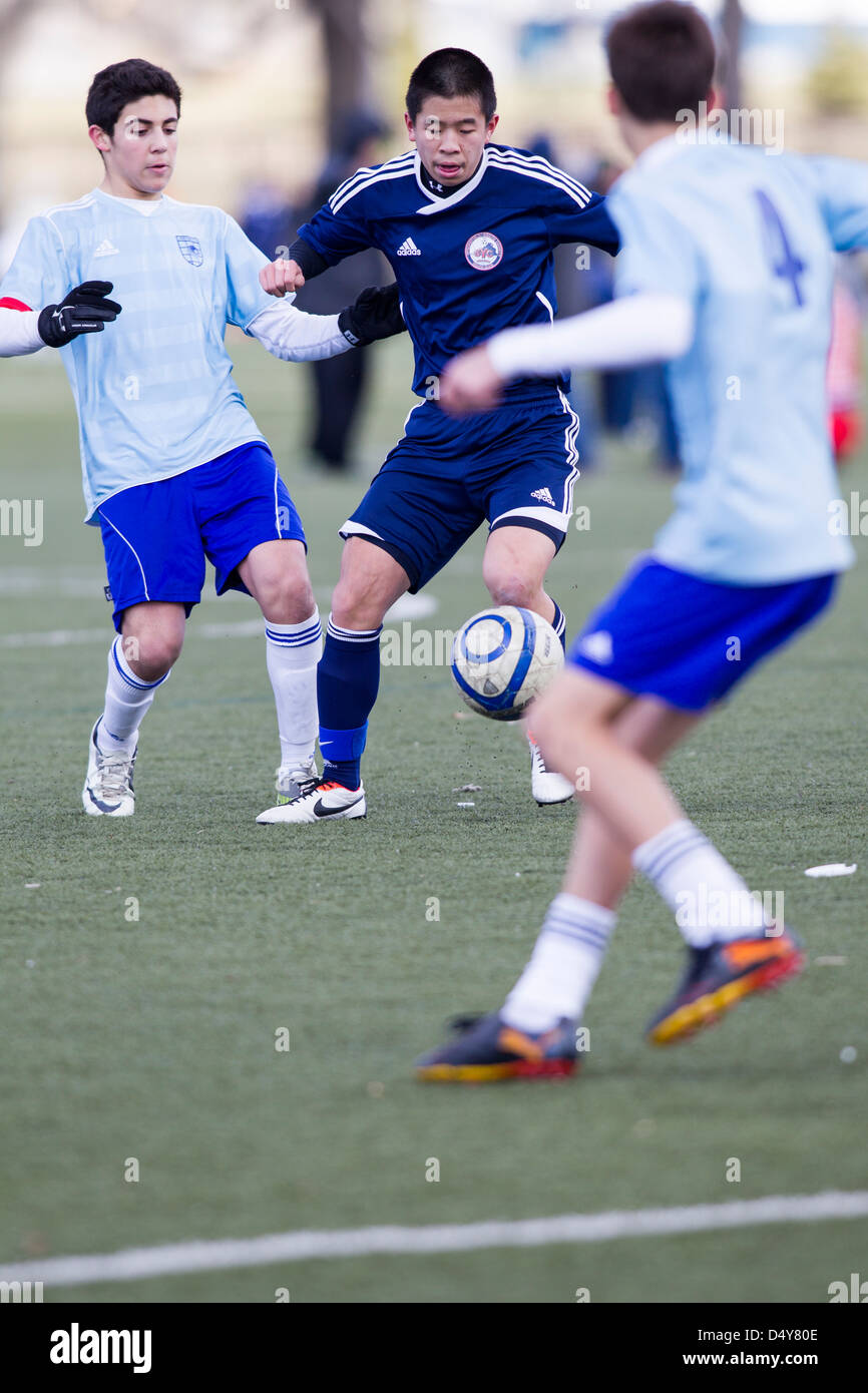Teen boys soccer action Stock Photo - Alamy