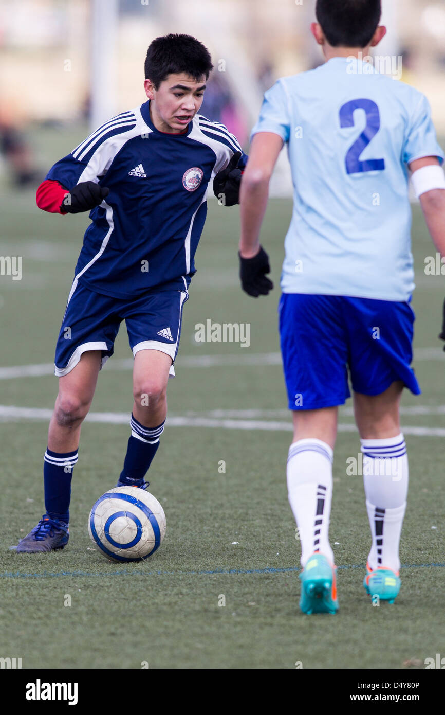 Teen boys soccer action Stock Photo - Alamy