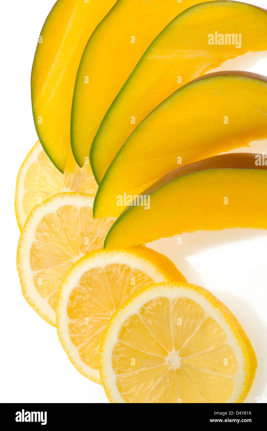 Mango slices and lemon slices on white Stock Photo - Alamy