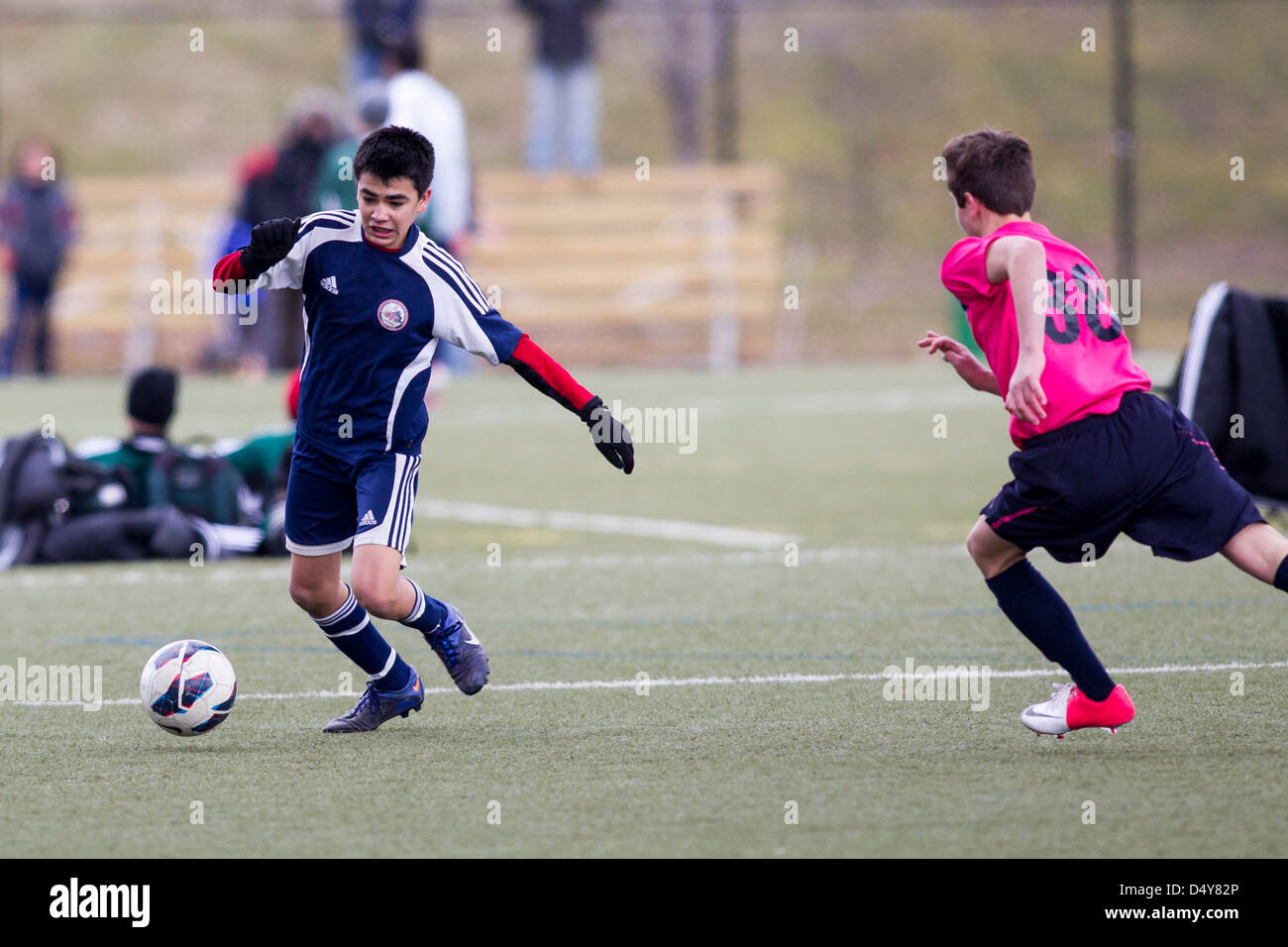 Teen boys soccer action Stock Photo - Alamy