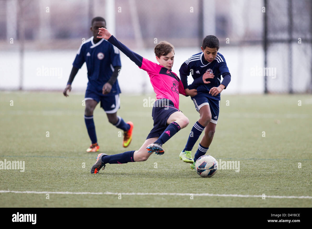 Teen boys soccer action Stock Photo - Alamy