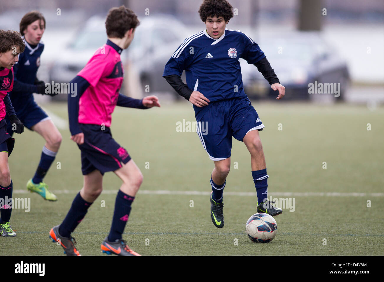 Teen boys soccer action Stock Photo - Alamy