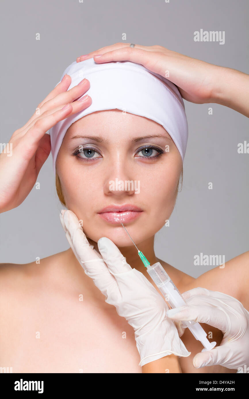 Cosmetic injection to the pretty female face Stock Photo - Alamy