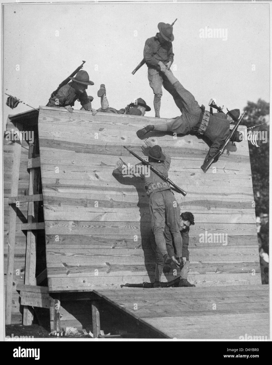 A photograph from around 1918 depicts soldiers participating in a wall ...