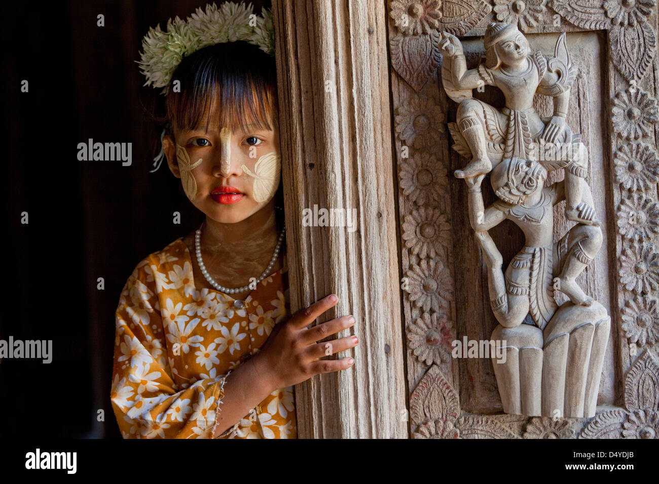 Portrait of a girl with face make-up and sun screen, Thanakha, Myanmar ...