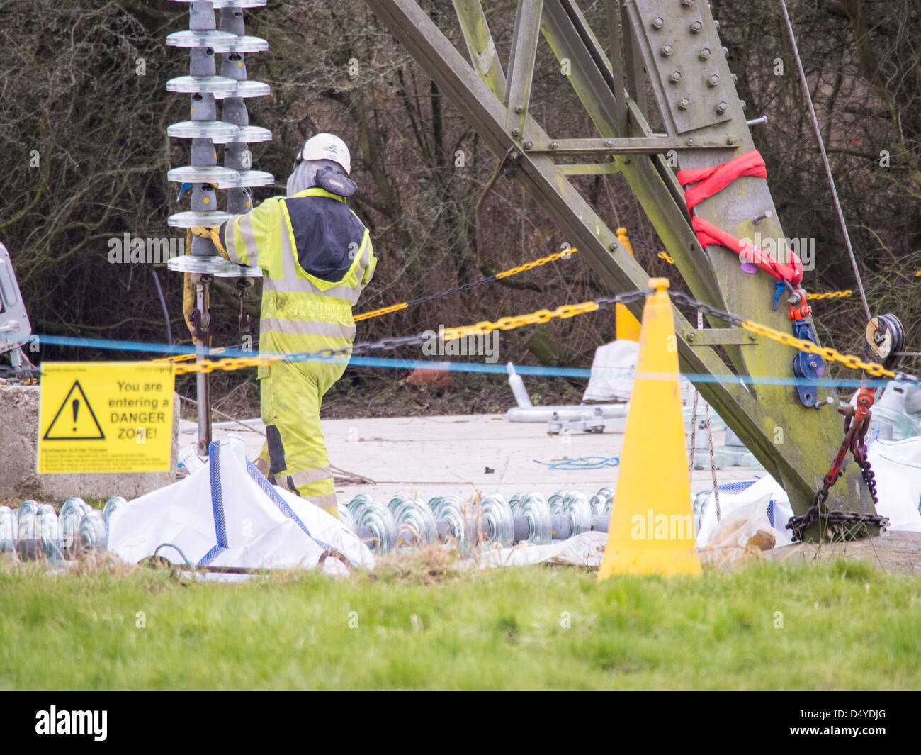 Technicians working to replace old insulators on a pylon in Barrow on ...