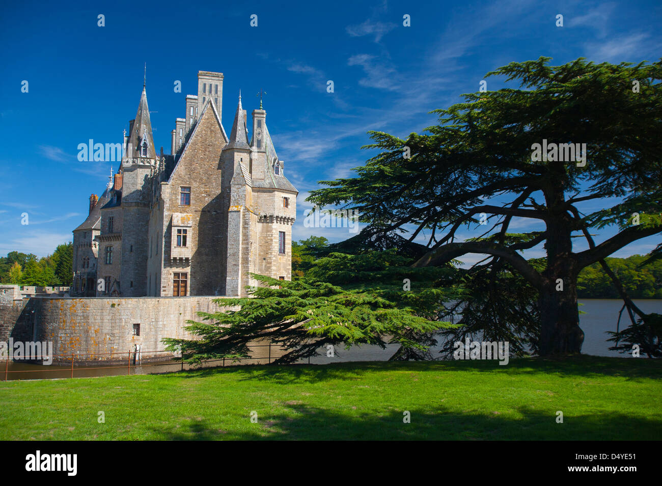 Chateau de la Bretesche, France, on lake surrounded by forest Stock ...
