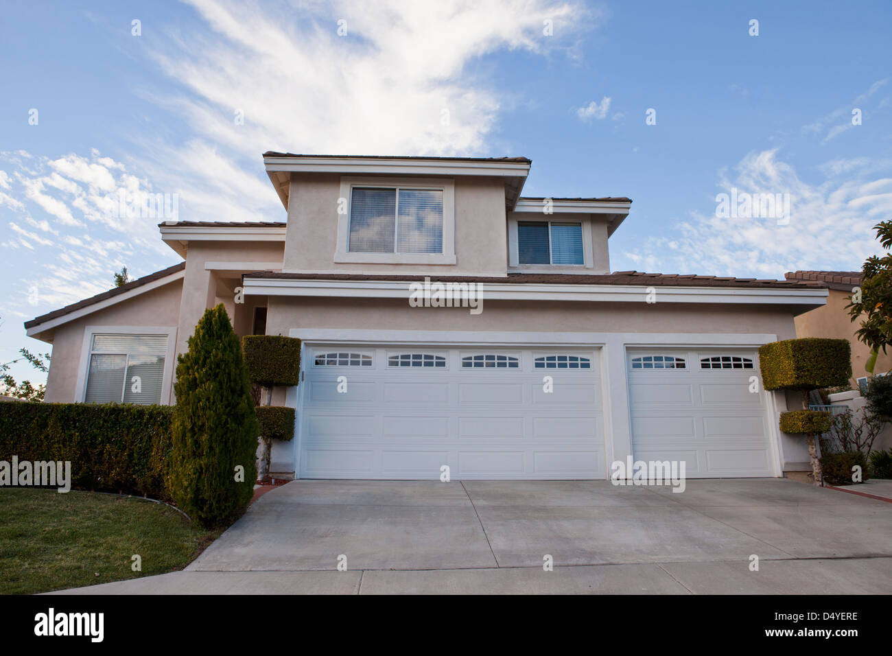 Exterior of middle class home with garages and driveway, Laguna Beach ...