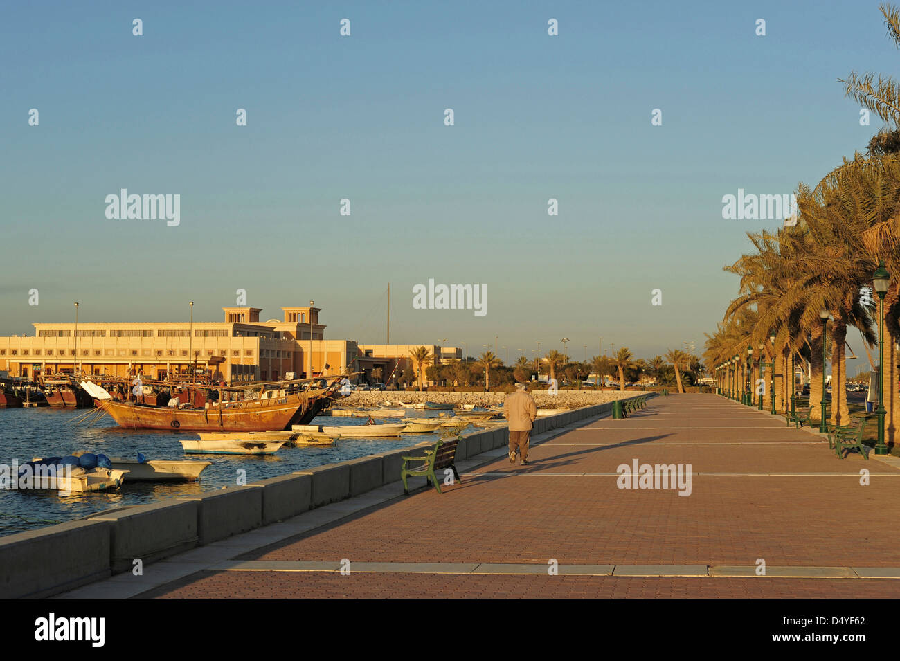 Kuwait, Kuwait City, wooden fishing boats next to promenade Stock Photo ...