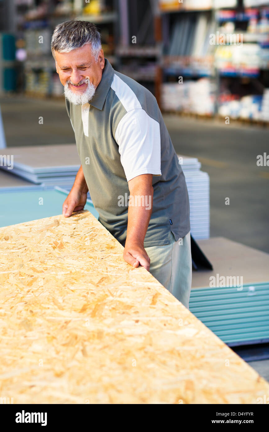 Senior man buying construction wood in a DIY store Stock Photo - Alamy