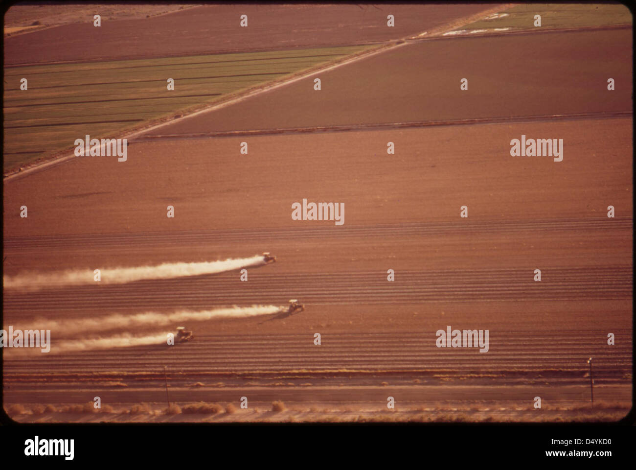 A photograph from May 1972 showing the process of fertilizing ...
