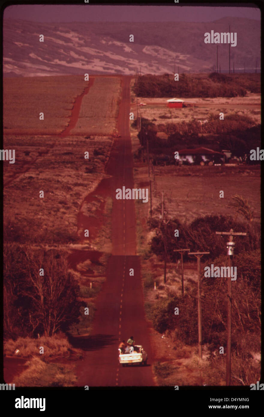 A photograph taken in October 1973 shows a remote highway in Molokai ...