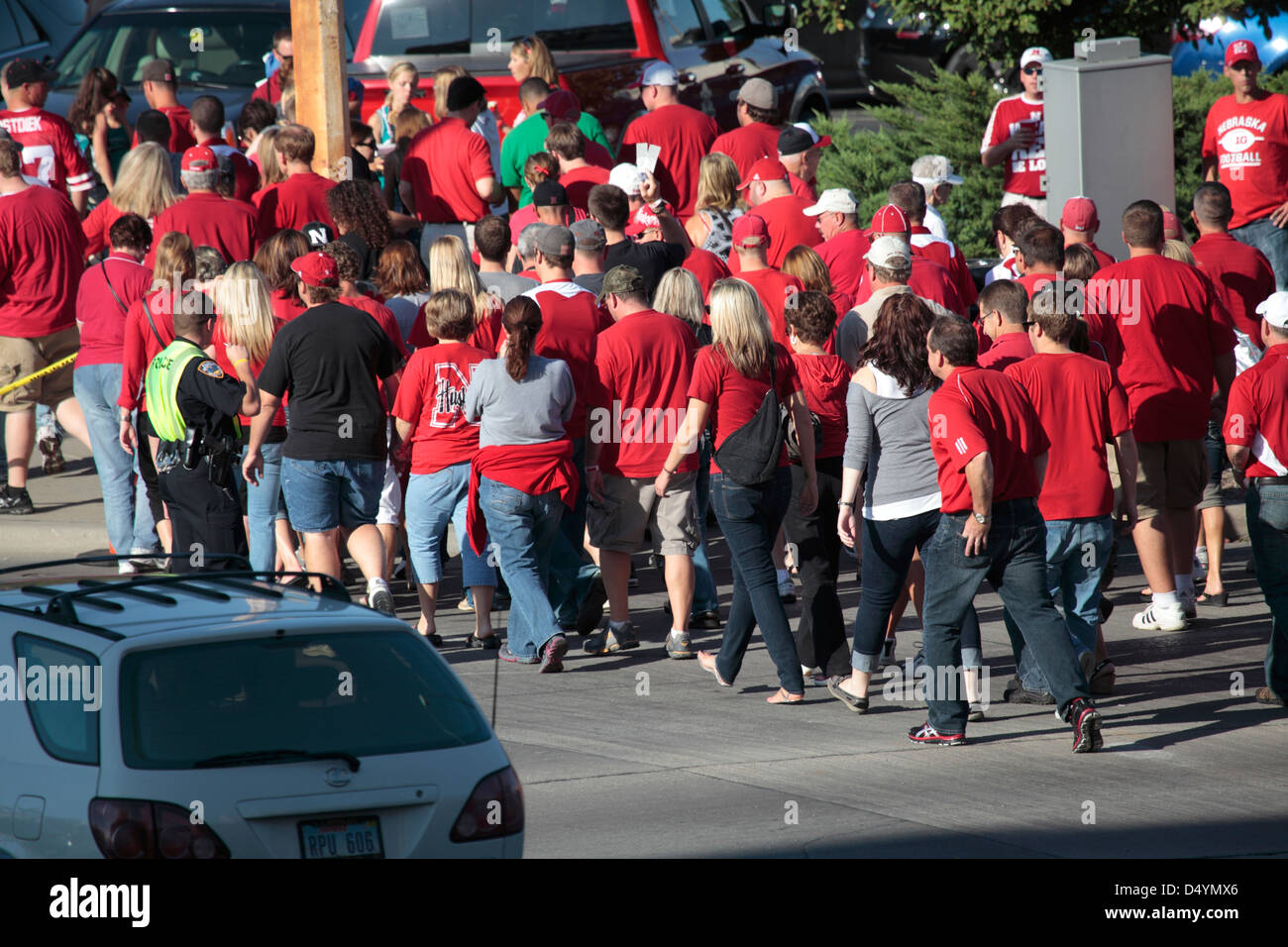 A crowd of Nebraska Cornhusker fans walking away Stock Photo - Alamy