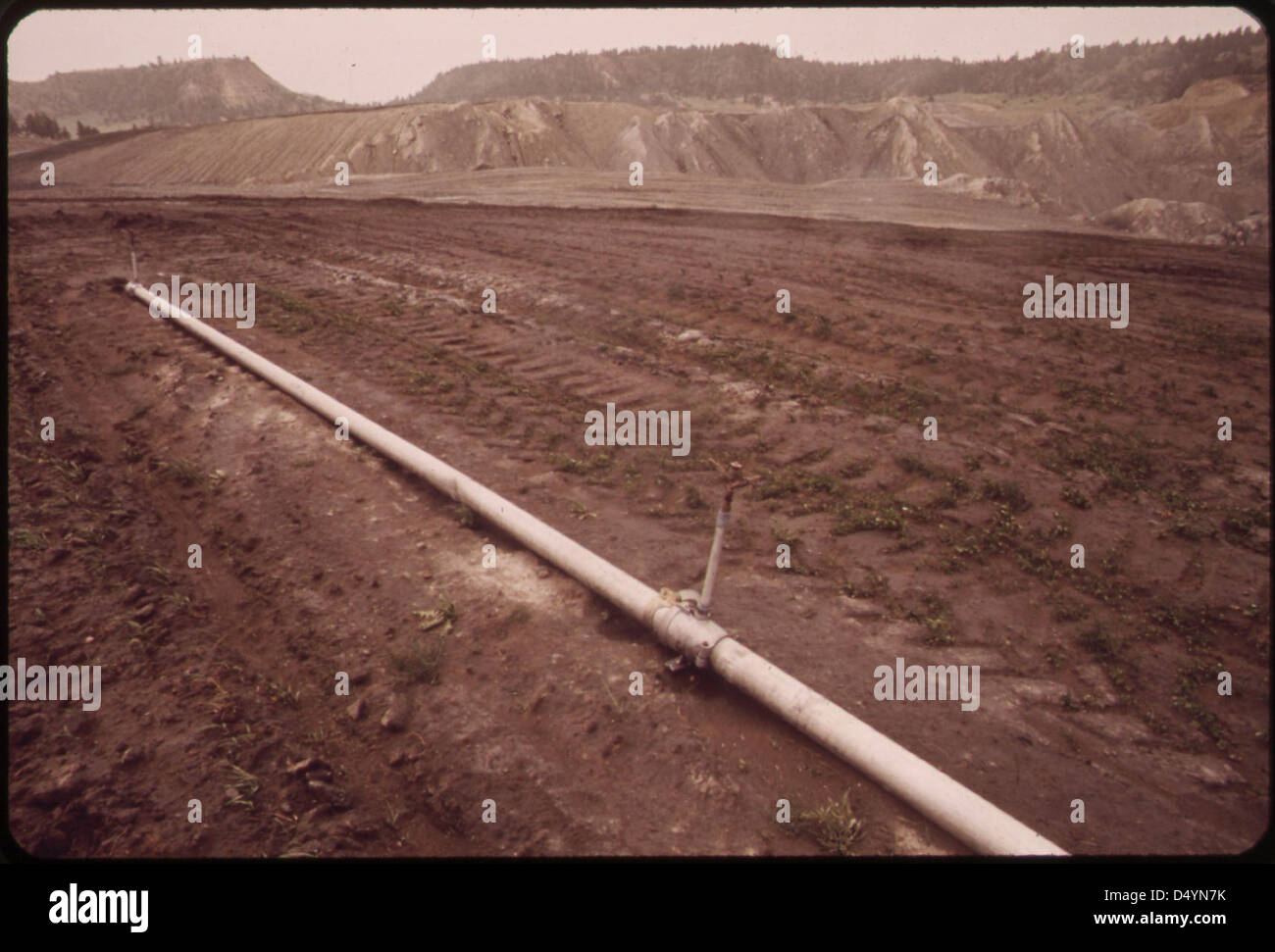 A photograph from June 1973 showing an irrigation pipe at the Peabody ...