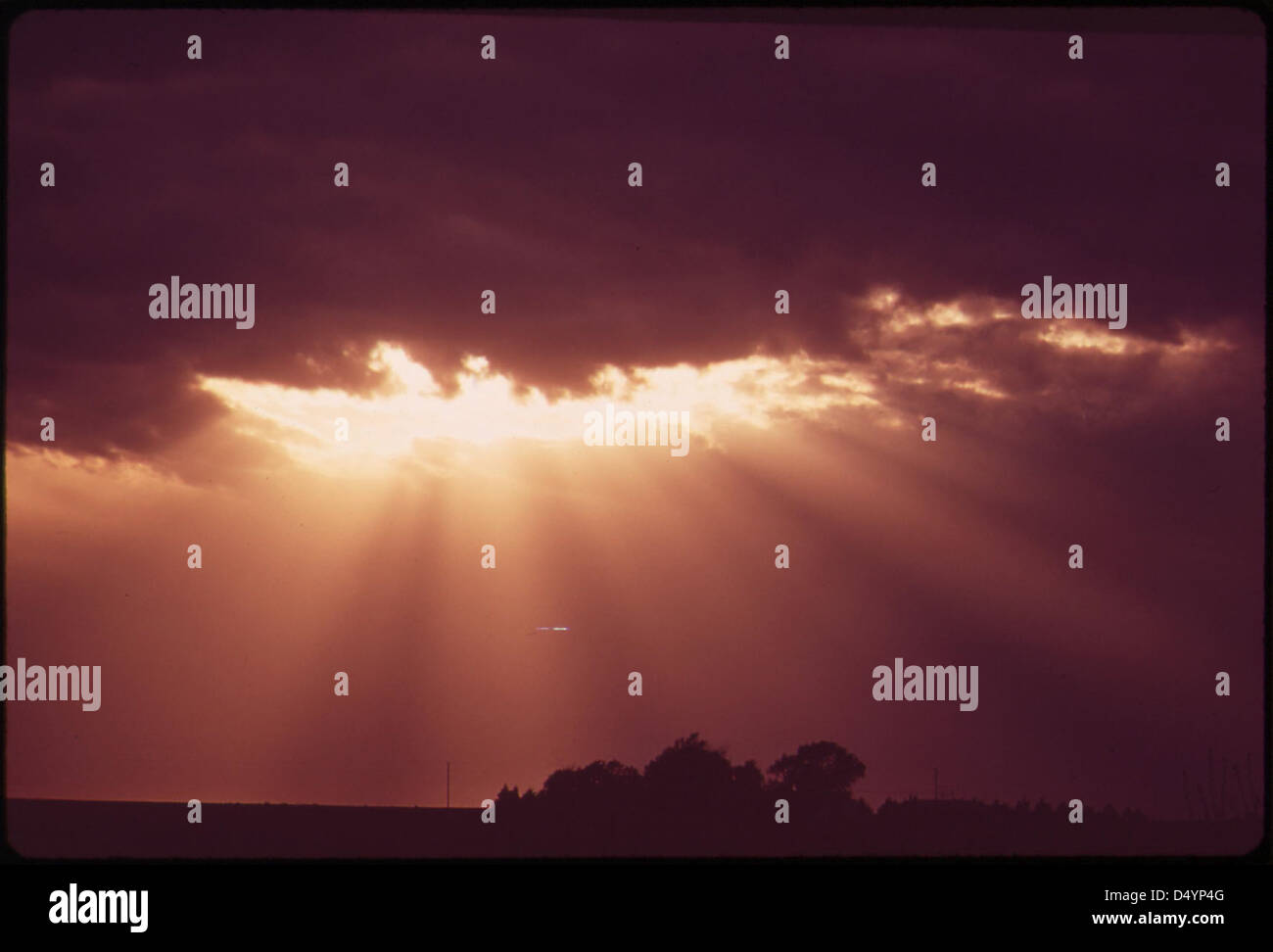 A photograph from May 1973 showing sun rays breaking through storm ...