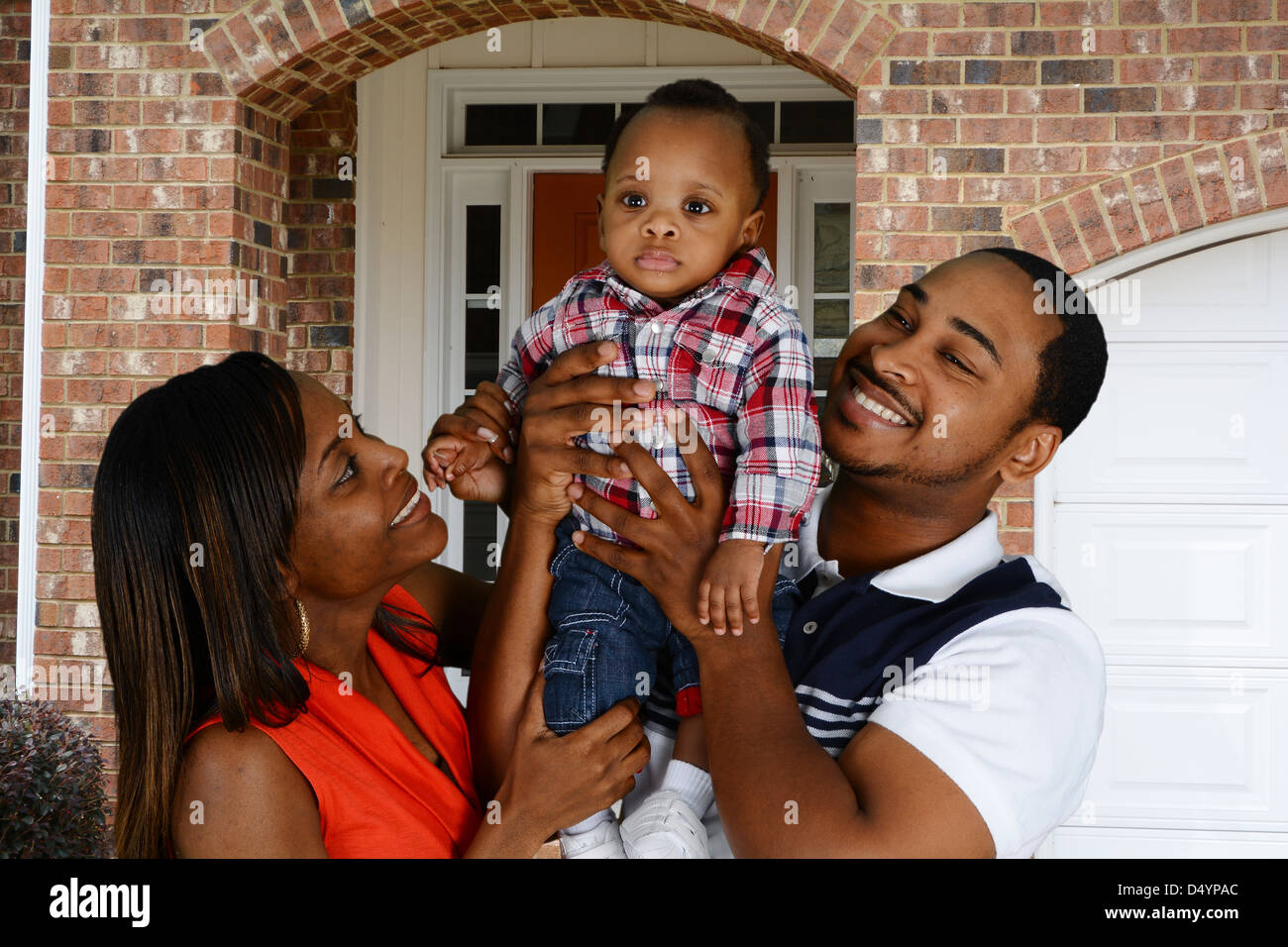 African American family together outside their home Stock Photo - Alamy