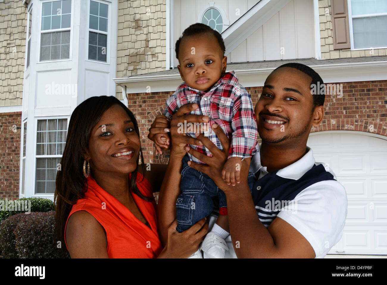 African American family together outside their home Stock Photo - Alamy