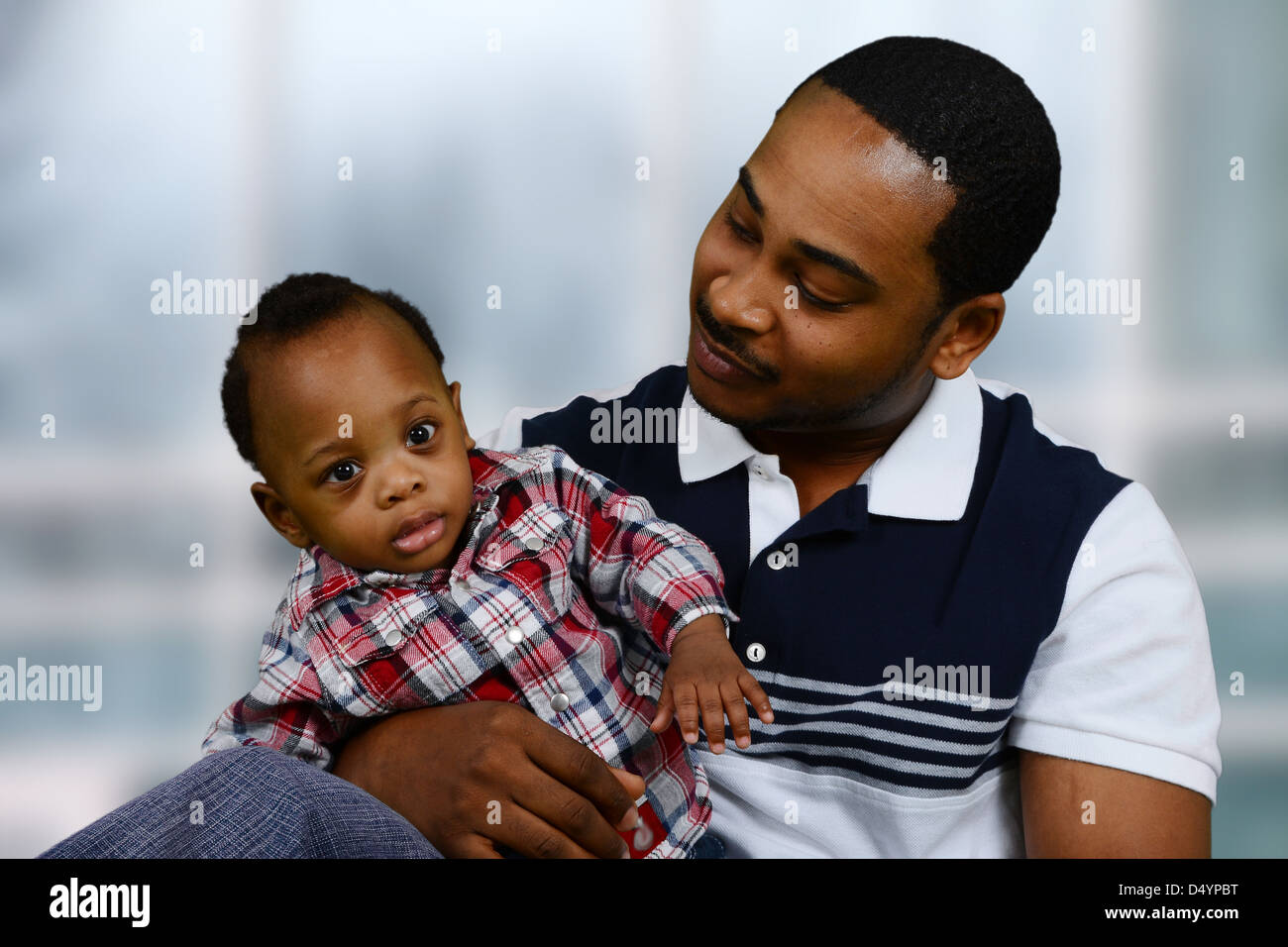 Father and his son playing inside their home Stock Photo - Alamy
