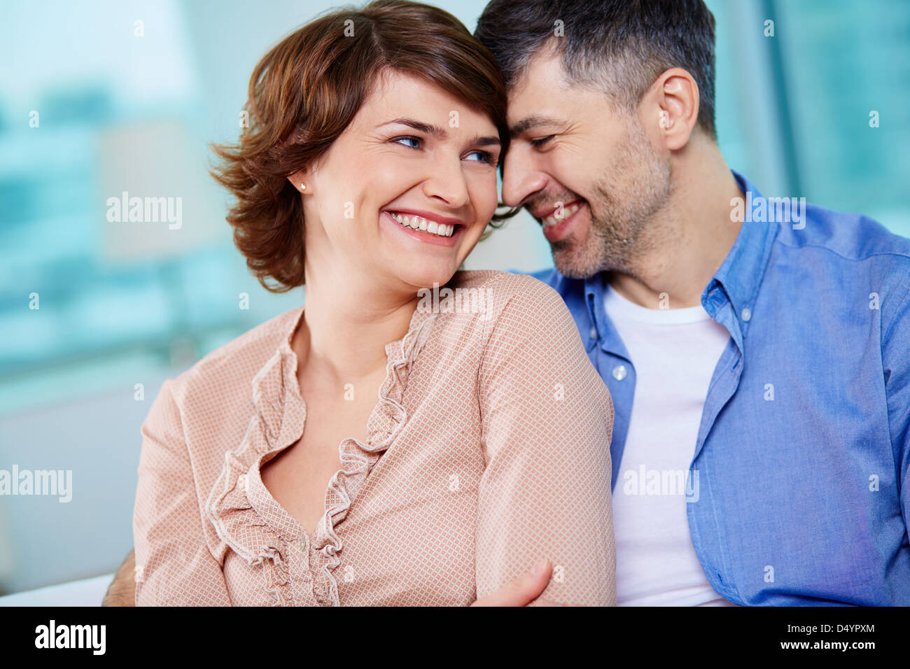 Portrait of happy middle aged couple laughing Stock Photo - Alamy