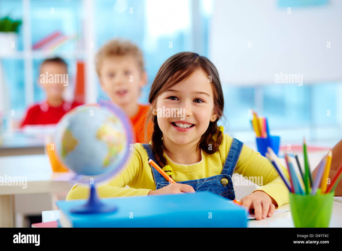 Image of a cute pupil with cheerful smile Stock Photo - Alamy