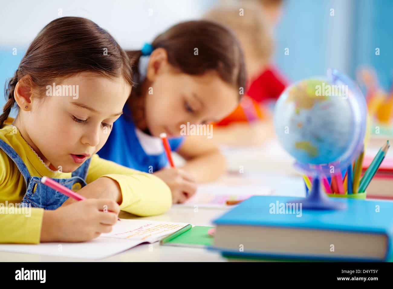 Cute pupils writing desk in hi-res stock photography and images - Alamy
