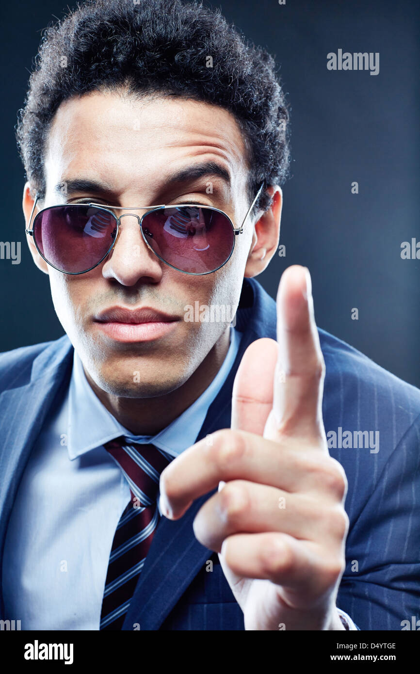Vertical portrait of a cool businessman wagging his finger Stock Photo ...