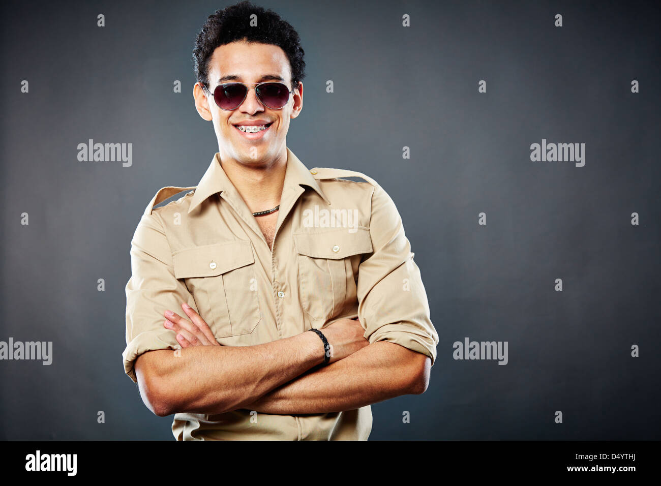 Copy-spaced shot of a happy dude posing against black background Stock ...