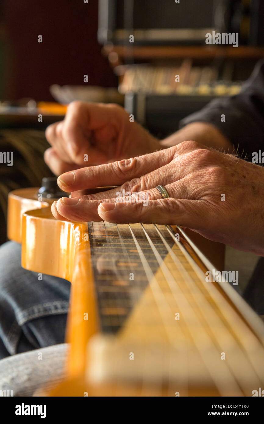 Old Musician hands playing instrument Stock Photo - Alamy