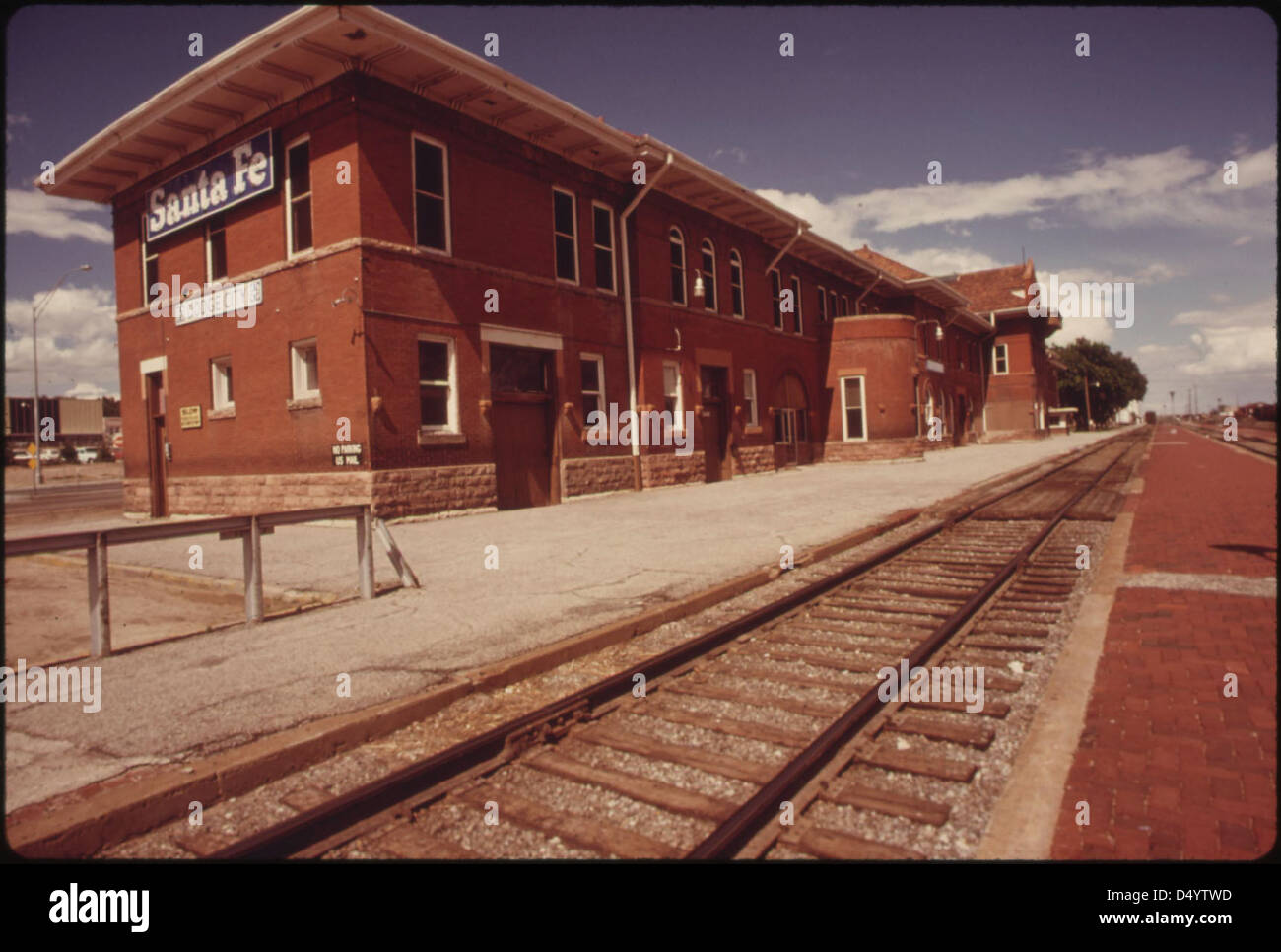 This 1974 photograph captures two trains passing through Dodge City ...
